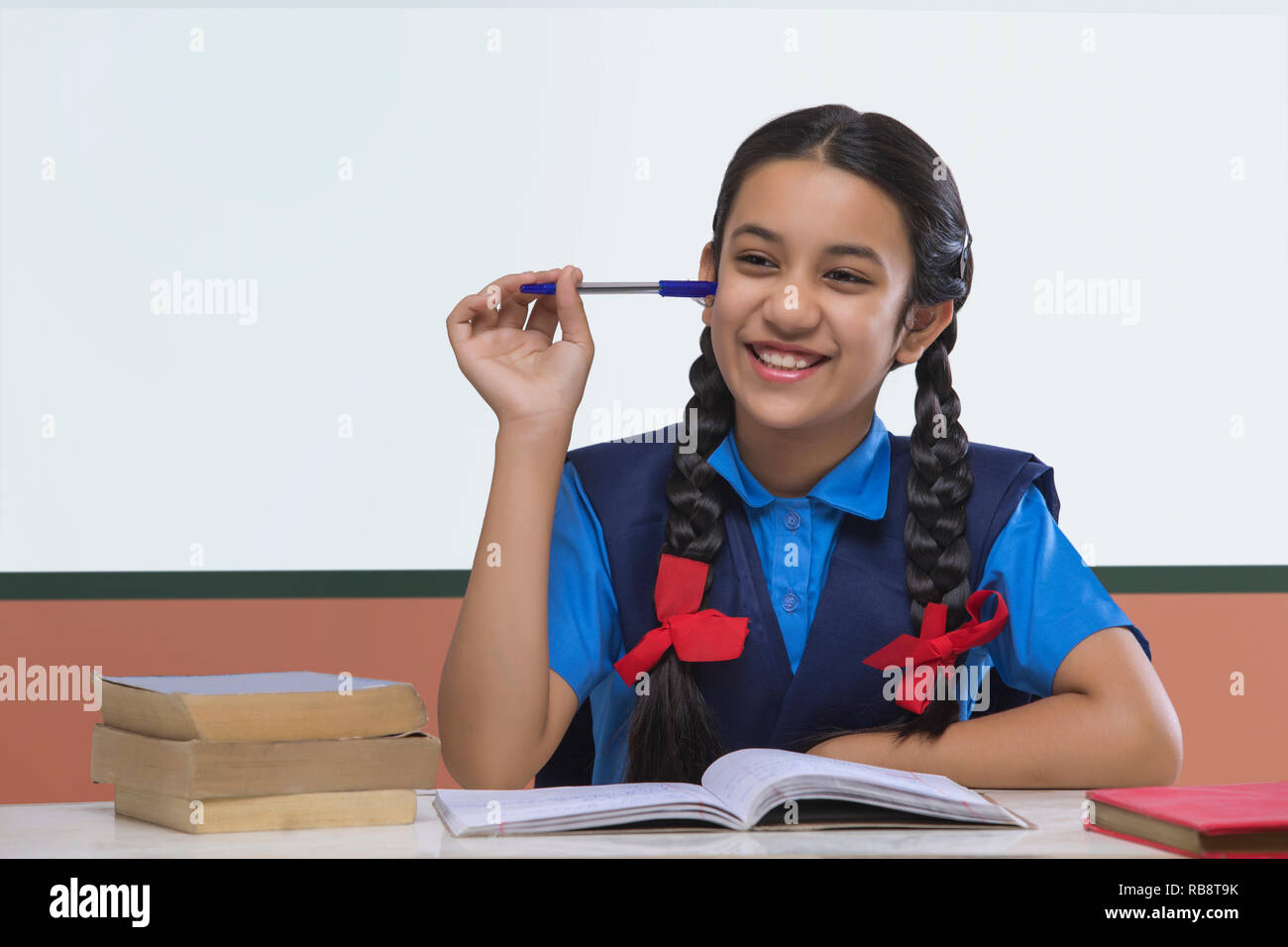 Girl with pen hi-res stock photography and images - Alamy