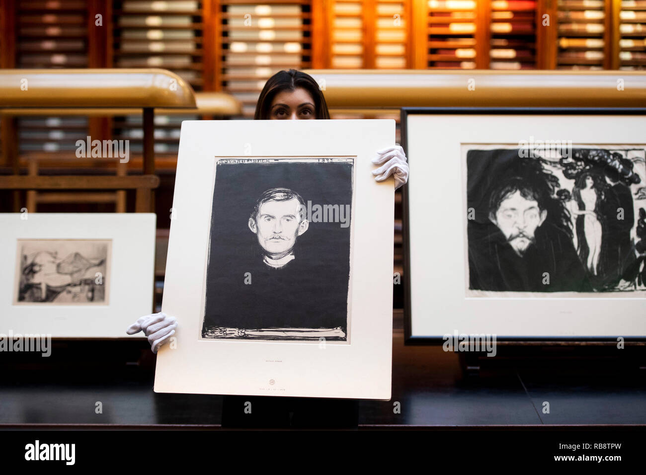 A staff member at the British Museum in London holds 'Self-Portrait ...