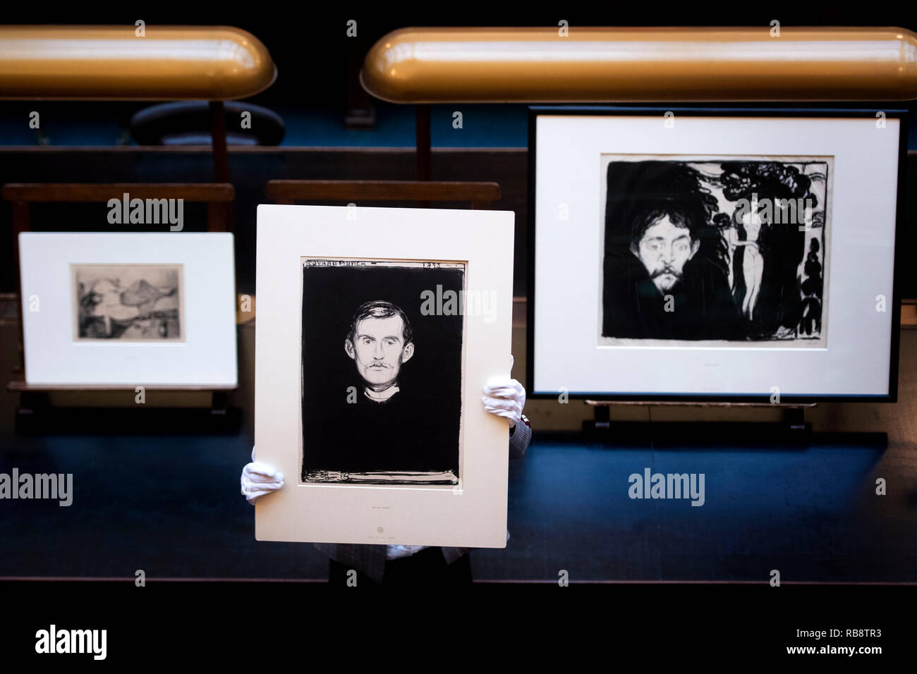 A staff member at the British Museum in London holds 'Self-Portrait ...