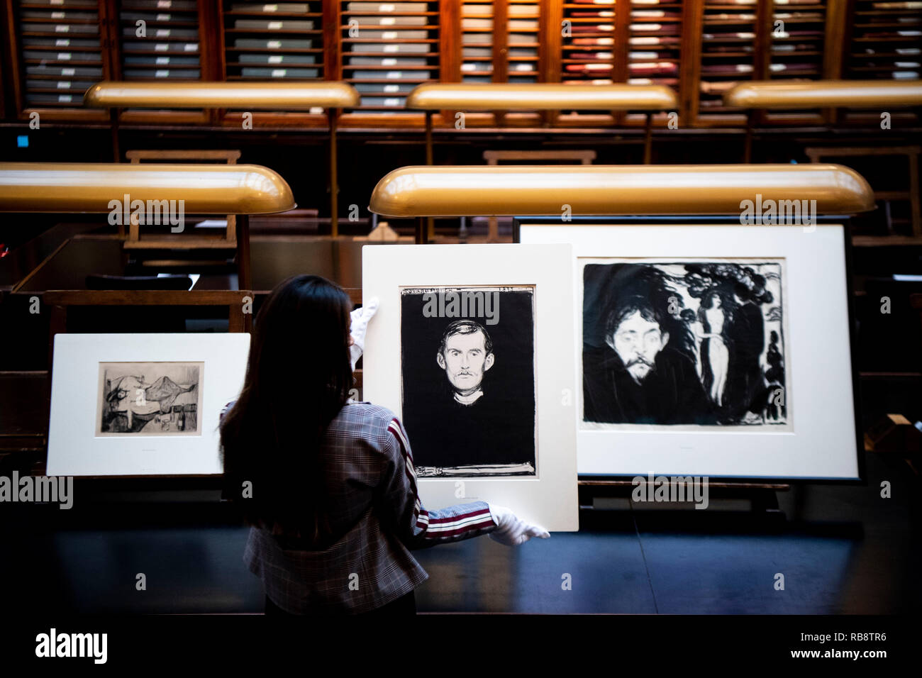 A staff member at the British Museum in London holds 'Self-Portrait ...