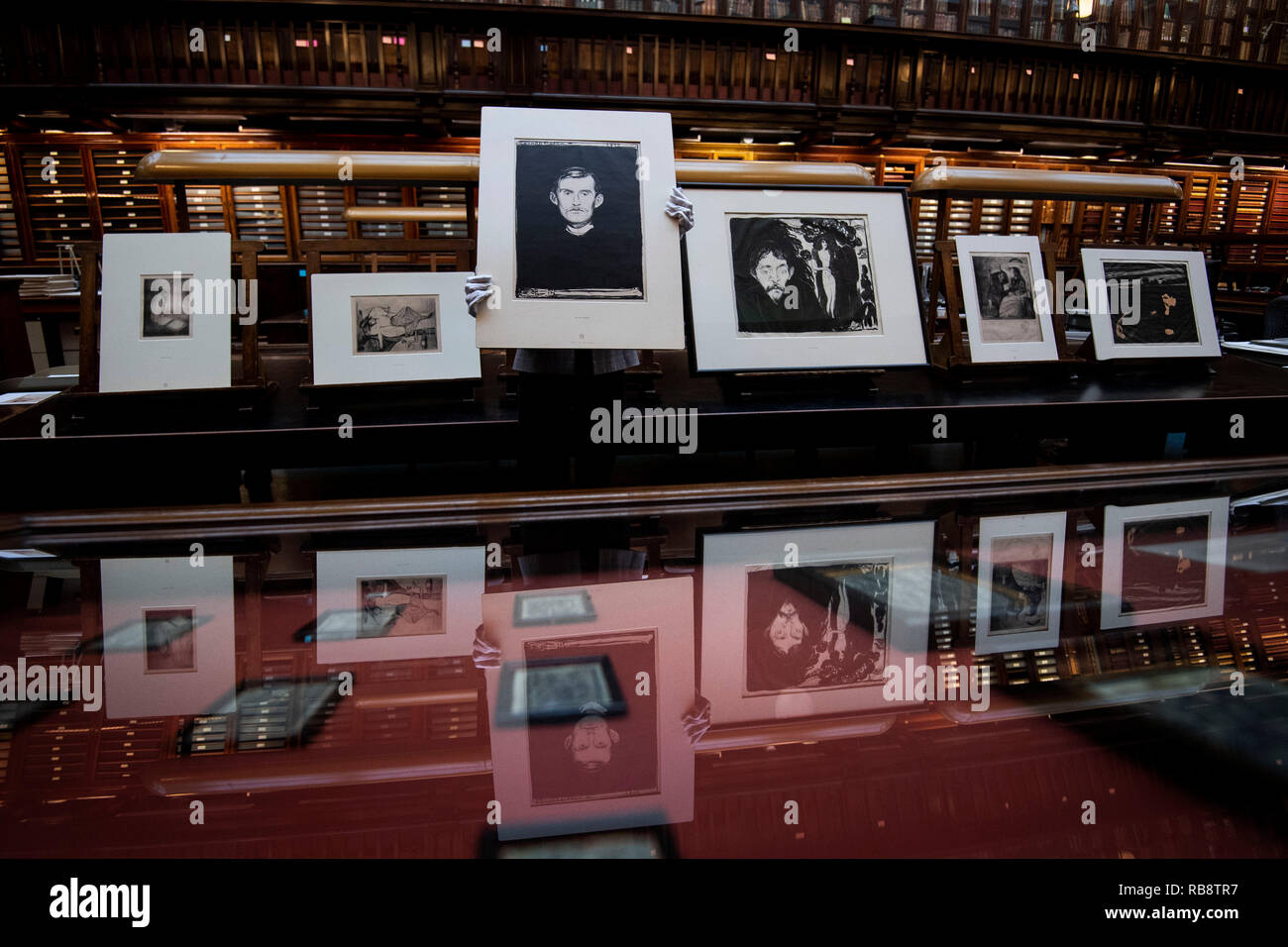 A staff member at the British Museum in London holds 'Self-Portrait ...