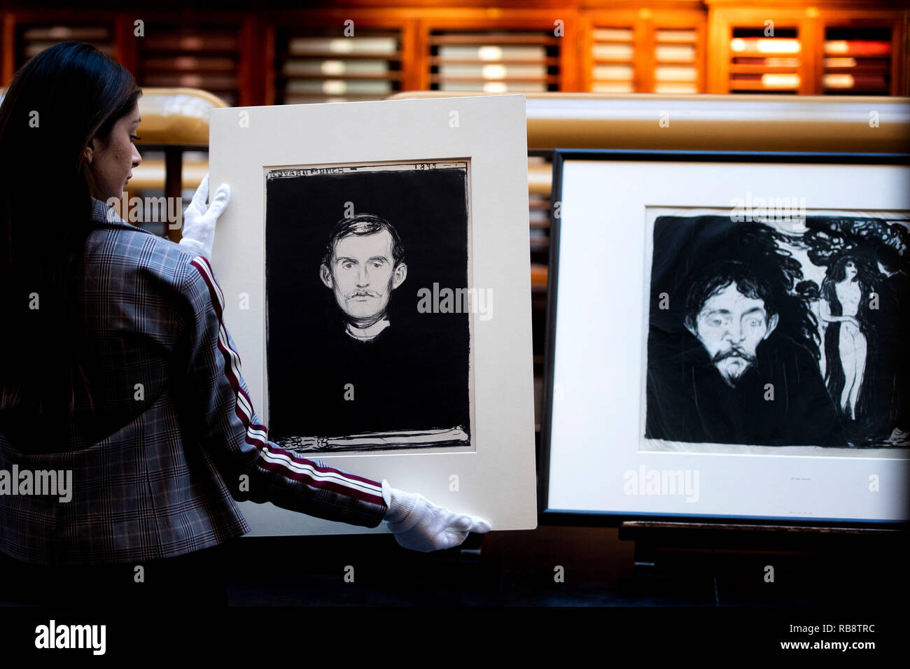 A staff member at the British Museum in London holds 'Self-Portrait ...