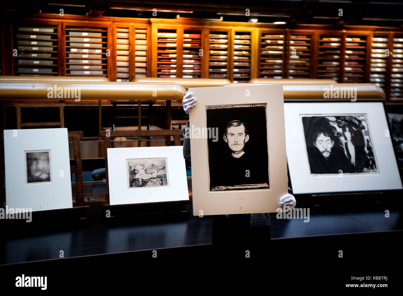 A staff member at the British Museum in London holds 'Self-Portrait ...