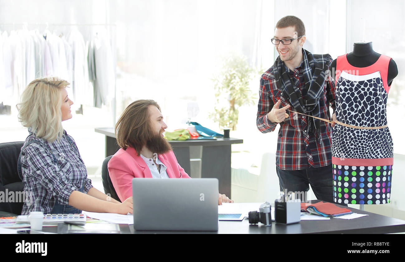 Fashion designer team at work in the office Stock Photo - Alamy