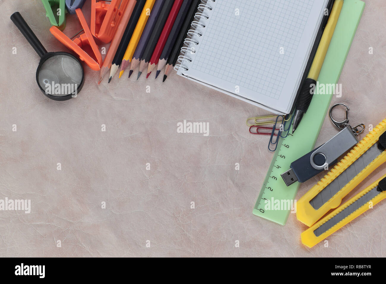 Notepad for taking notes and school supplies on a paper background ...