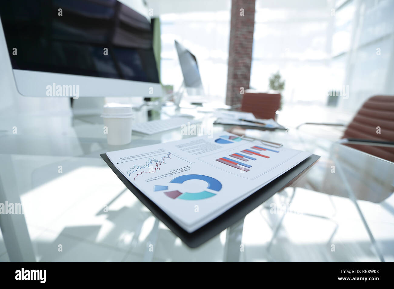 closeup.financial chart on the table from a businessman Stock Photo - Alamy