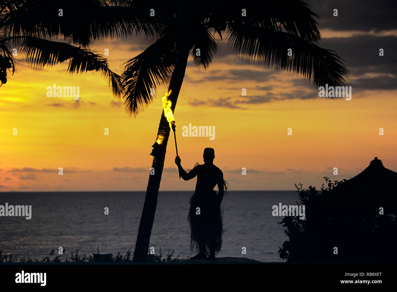 Traditional Fijian sunset torch lighting ceremony. Fiji, south Pacific ...