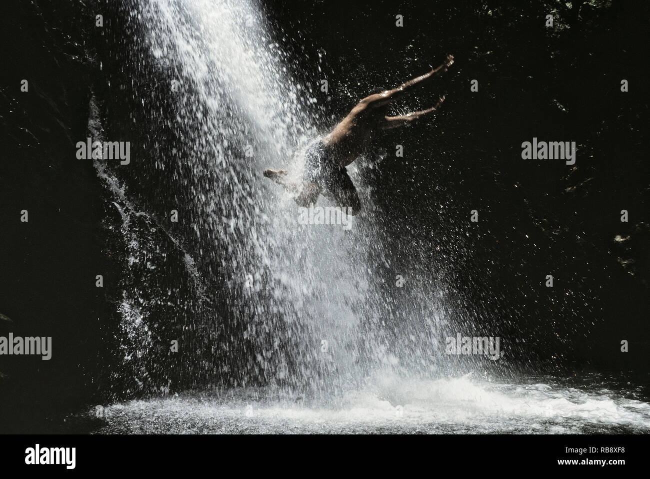 A man jumping into the Biausevu waterfall (also known as Savu Na Mate ...