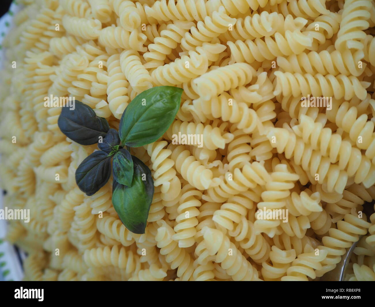 Spirelli Pasta in a bowl on a birthday party Stock Photo - Alamy