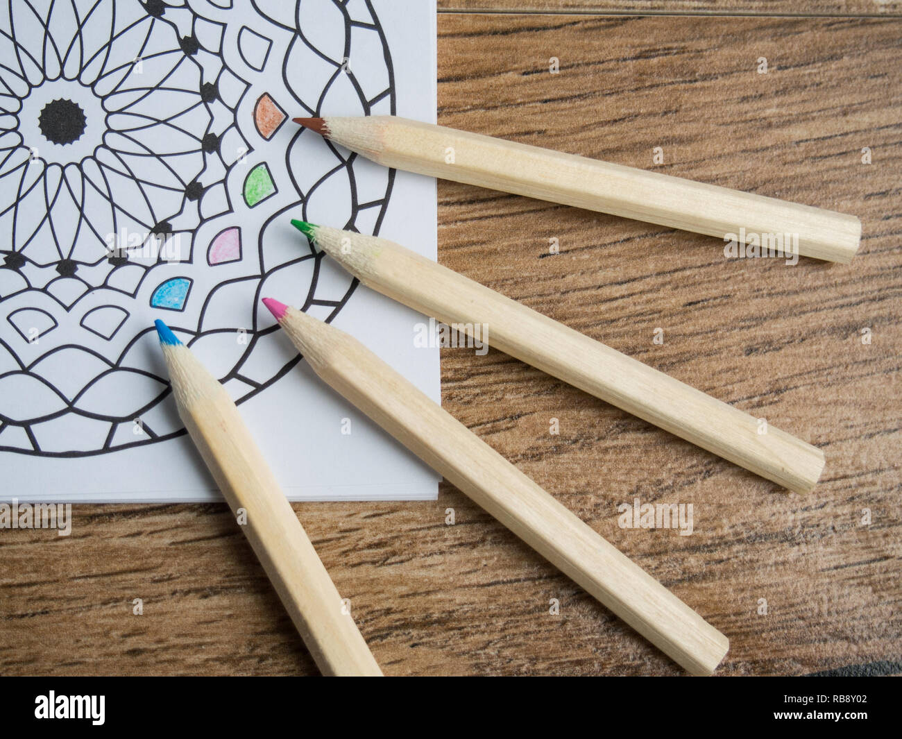 Mandala with colored pencils Stock Photo - Alamy