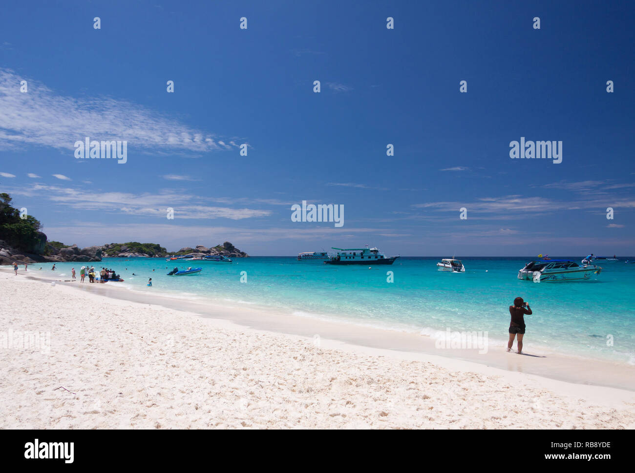 Turquoise sea with speed boat Stock Photo - Alamy