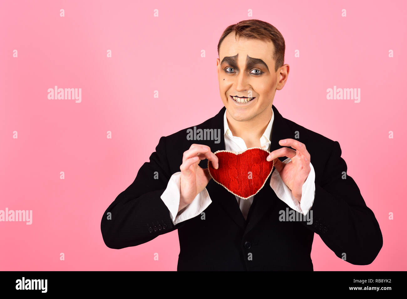 Big hearted. Happy mime falling in love. Mime man hold red heart for ...