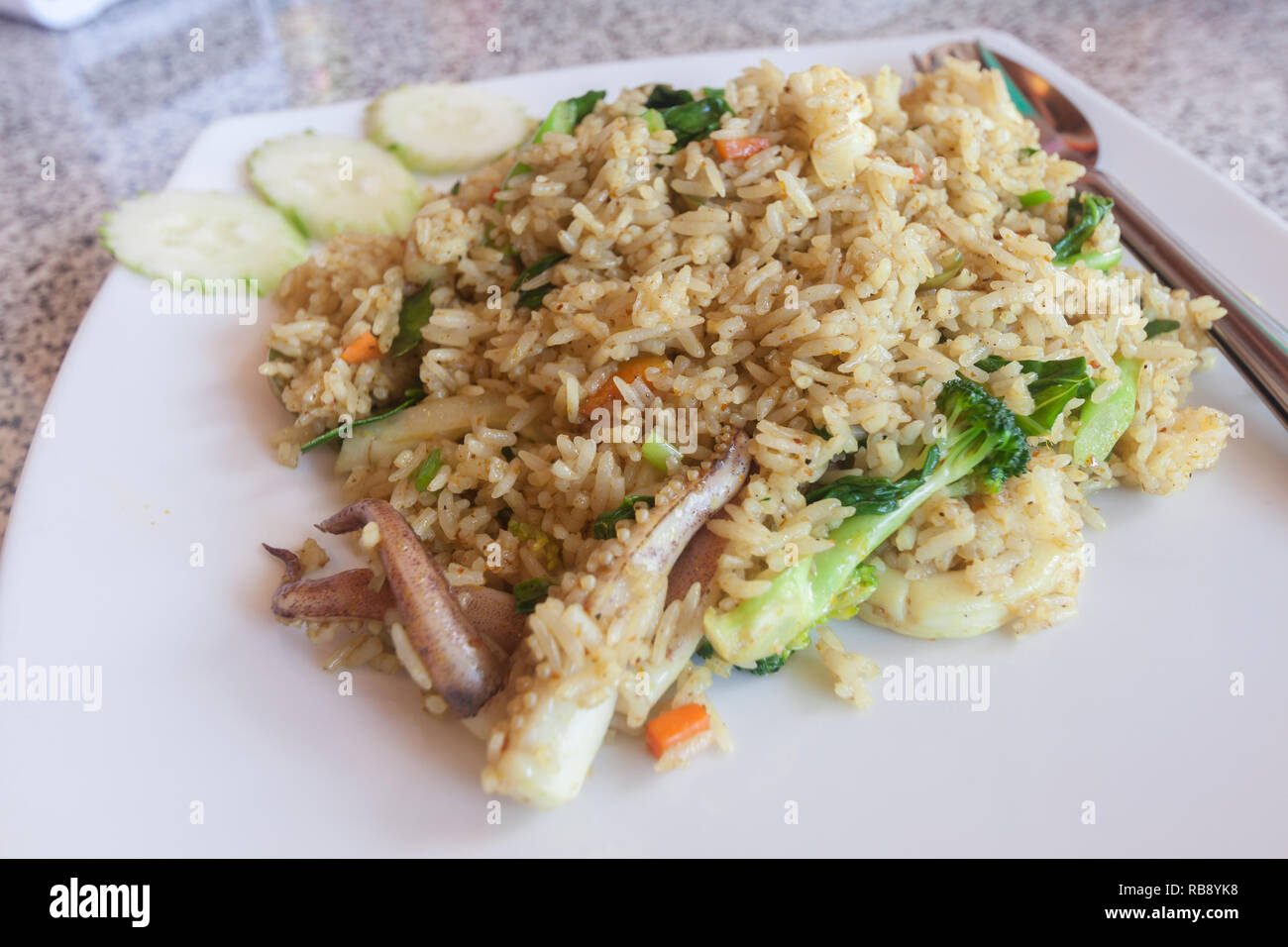 Fried rice with squid Stock Photo - Alamy