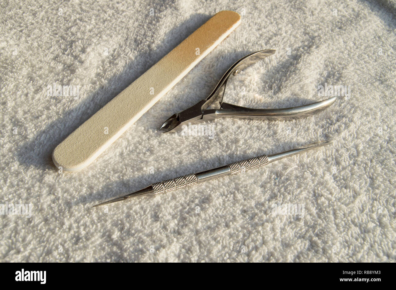 Tools of a manicure set on white background, concept of care of nails ...
