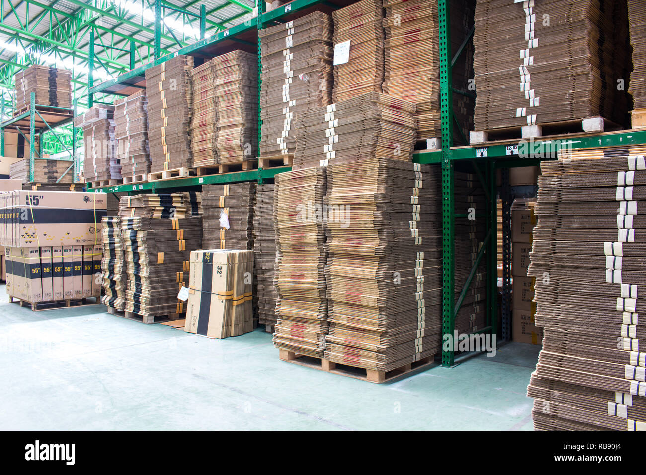 Pile of cardboard in a factory Stock Photo - Alamy