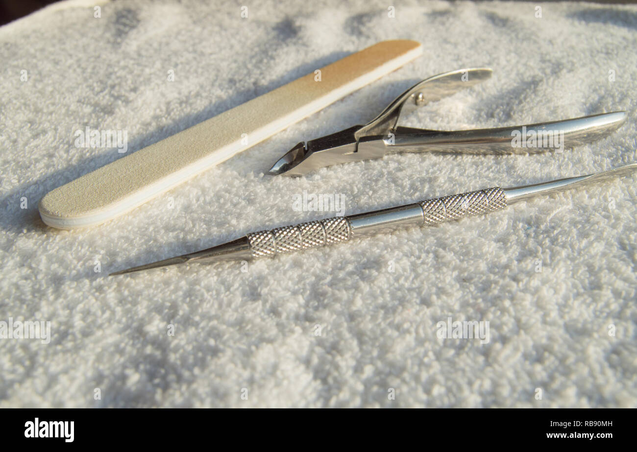Tools of a manicure set on white background, concept of care of nails ...