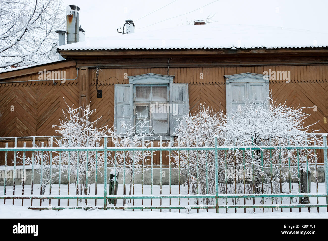Traditional russian house in winter. Homes are made by local wood and ...