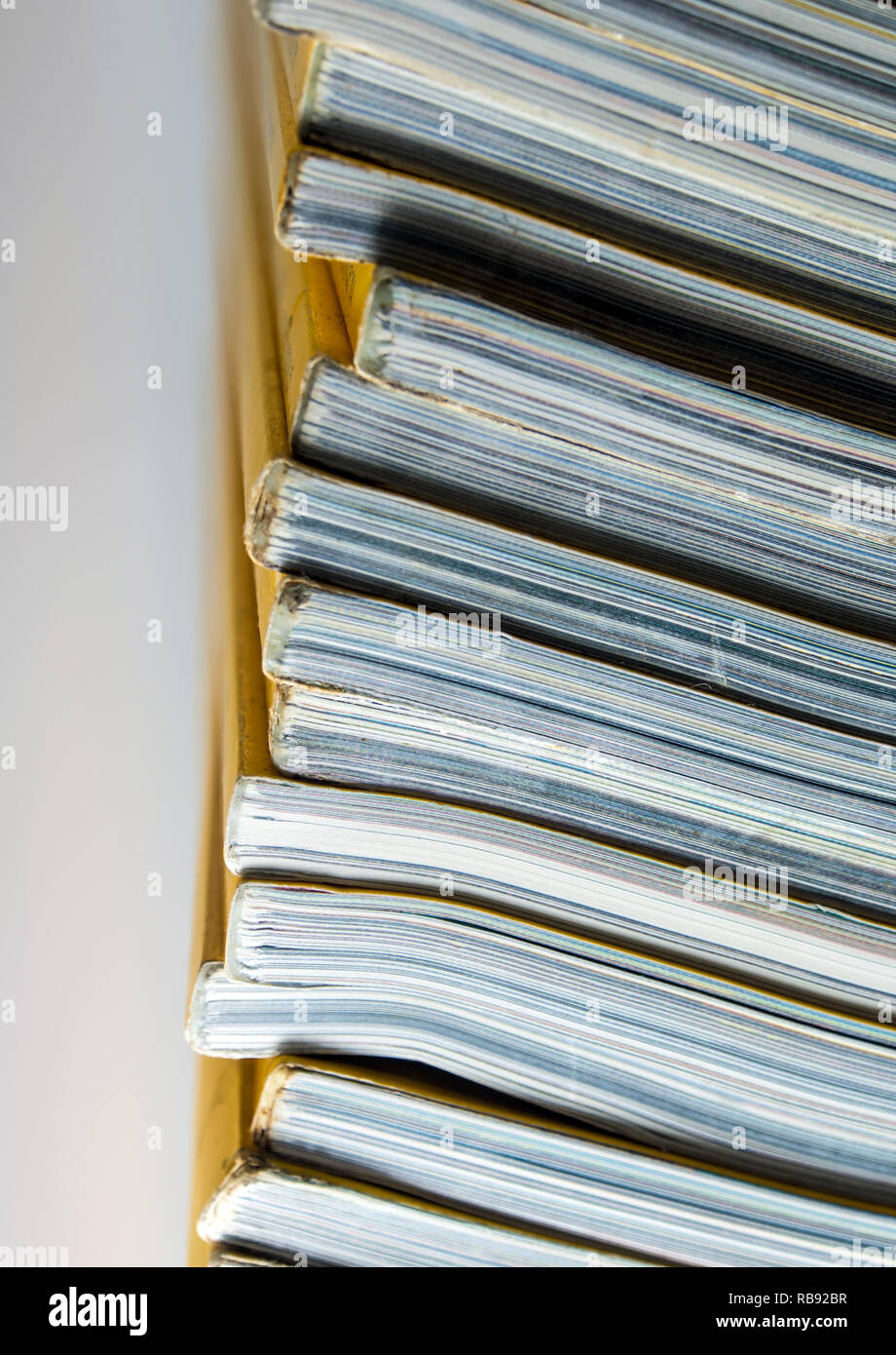 Stack of yellow color monthly magazine Stock Photo - Alamy