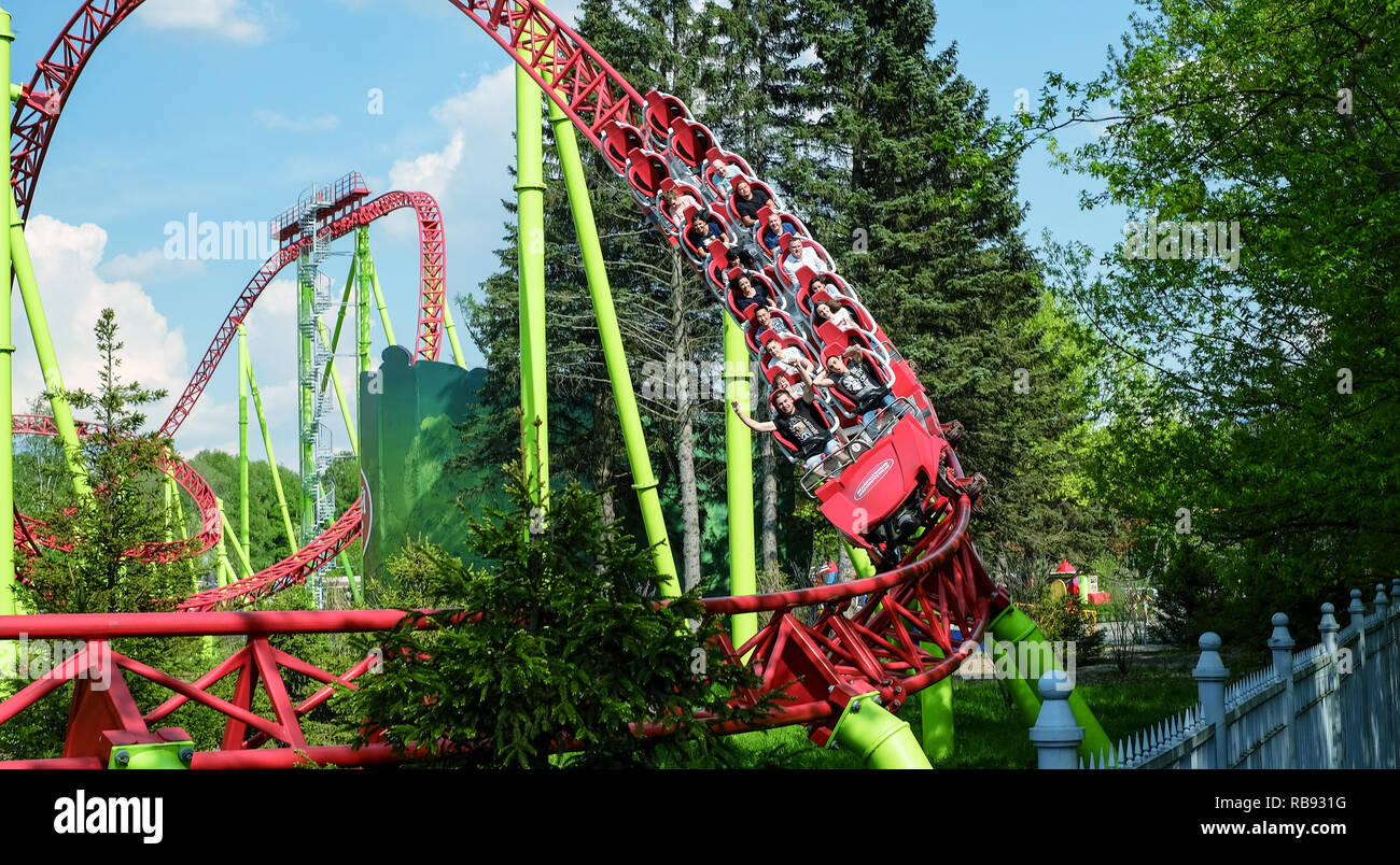 People have fun with their hands up. Emotions of joy and adrenaline ...