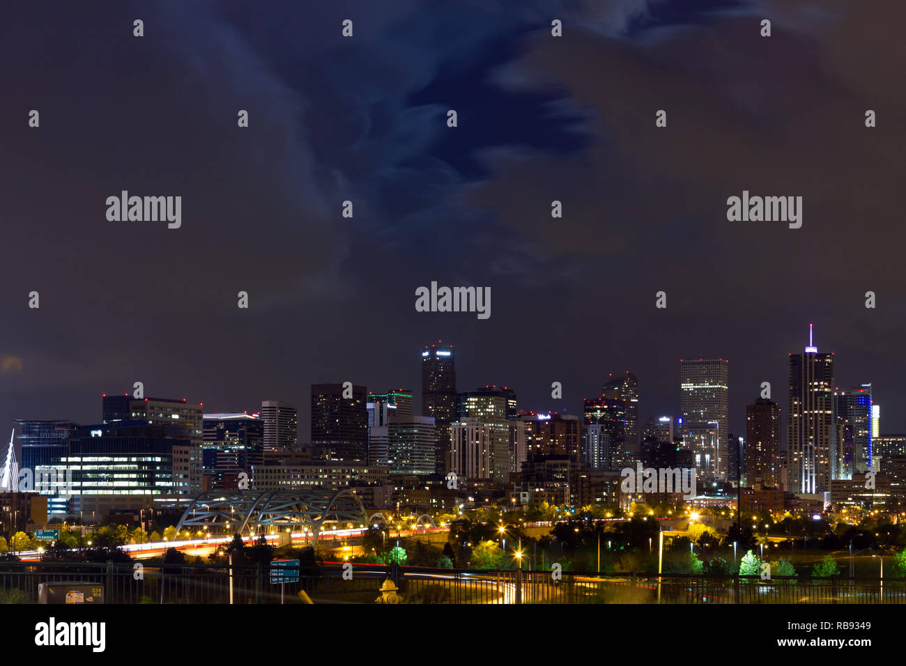 Denver Colorado downtown city skyline at night with clouds overhead ...