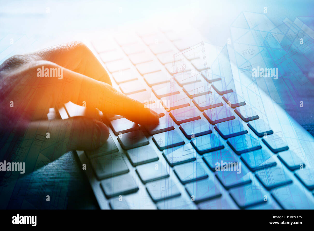 Closeup of architect hand typing on computer keyboard device in ...
