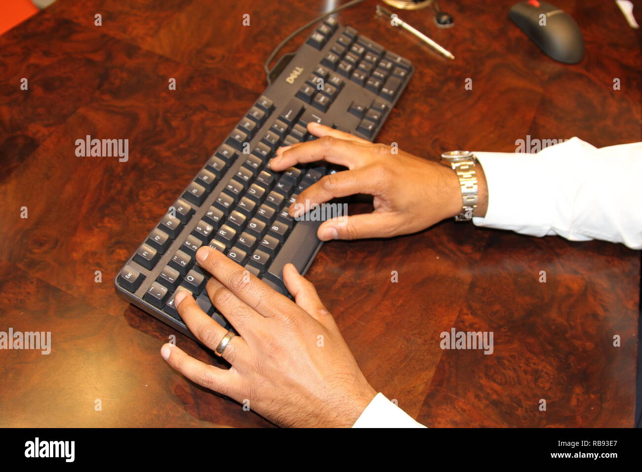 Banker at work with a keyboard. Consent given by the banker for this ...