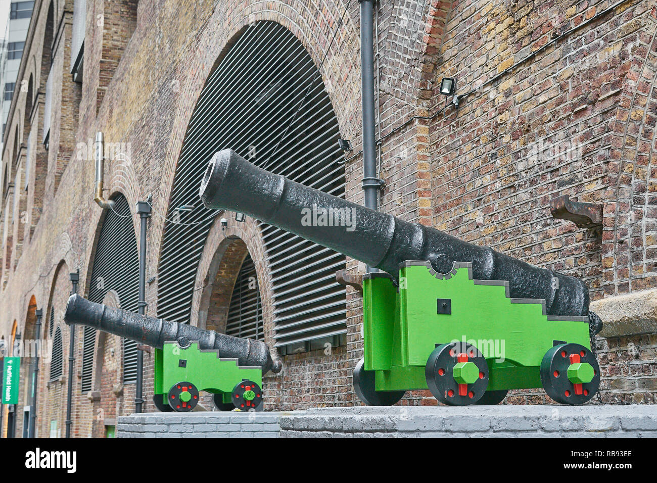 A pair of cannons on green painted mounts outside Cannon Street railway ...