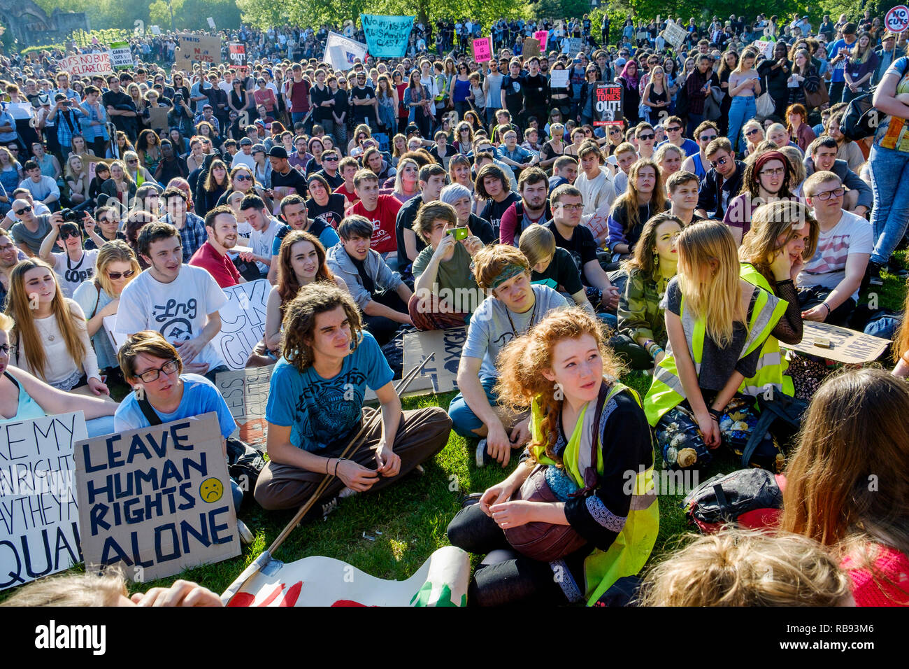 13th May, 2015. Protesters carrying anti-austerity placards are ...