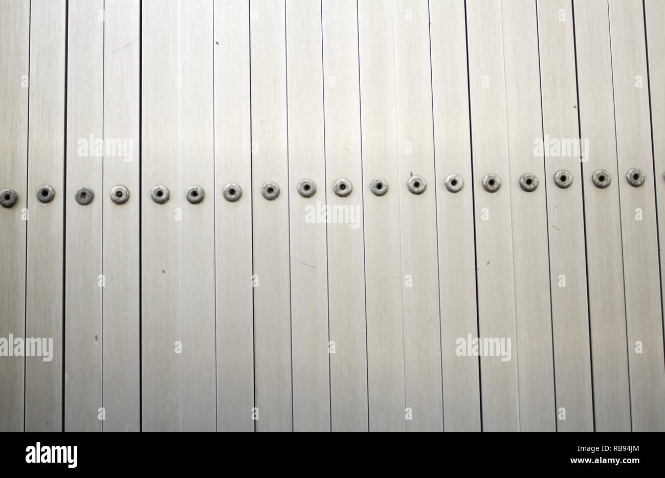 Spoiled and dirty metallic background, detail of a steel door down and ...