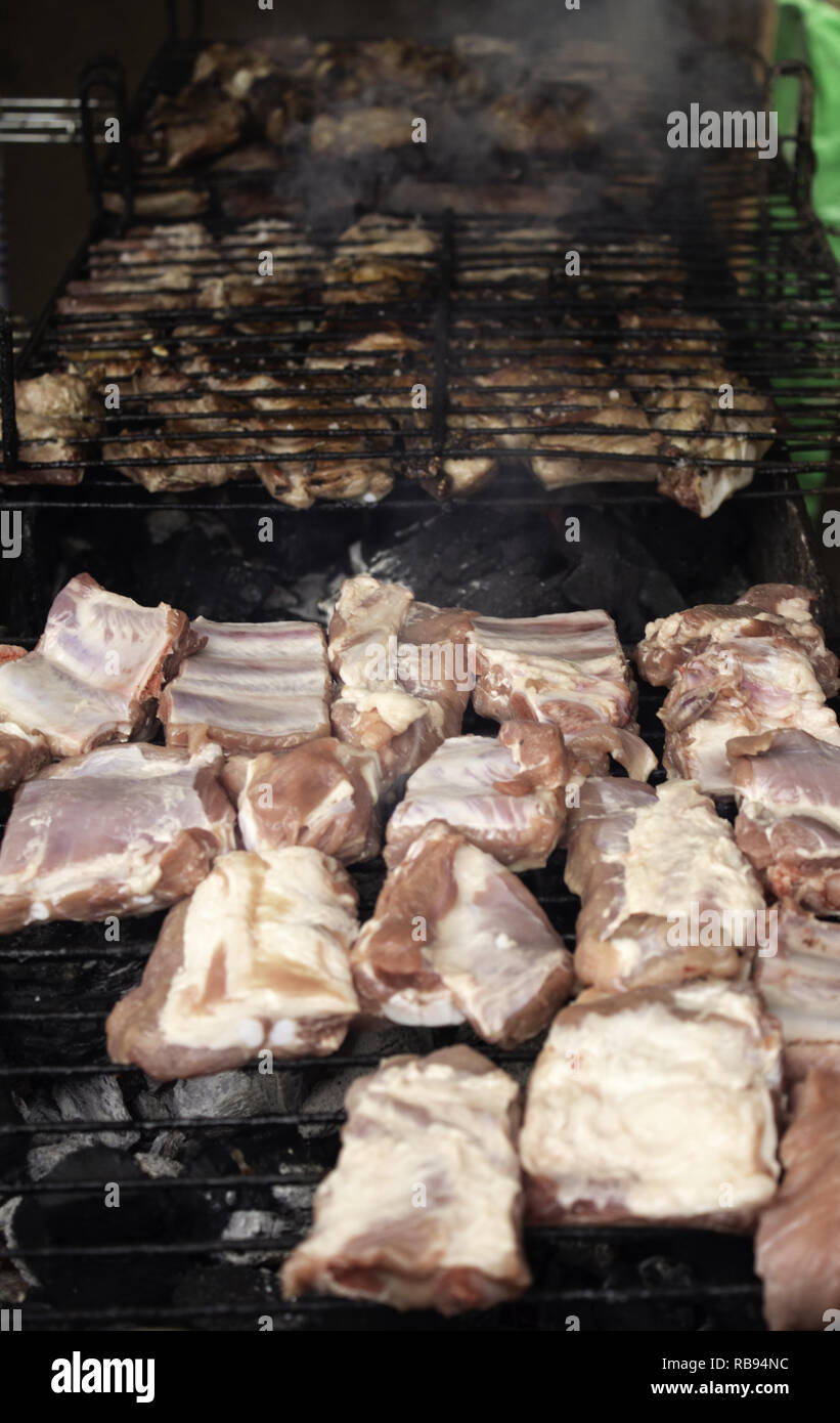 Meat on the grill, roasting meat on an ember with fire Stock Photo - Alamy