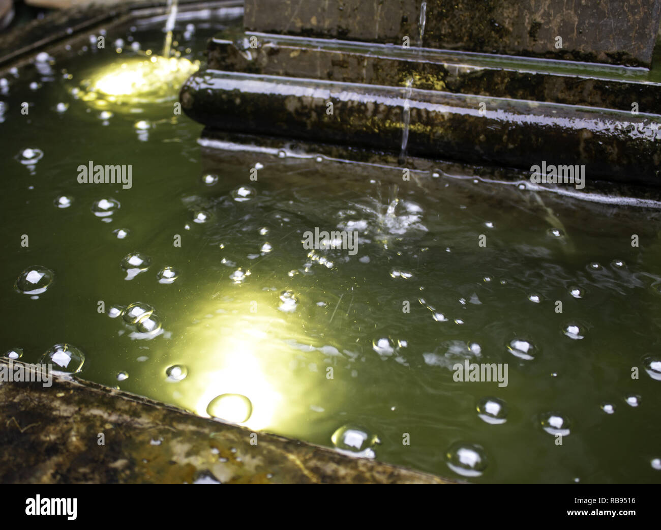 Fountain with lights and water drops, decoration Stock Photo - Alamy