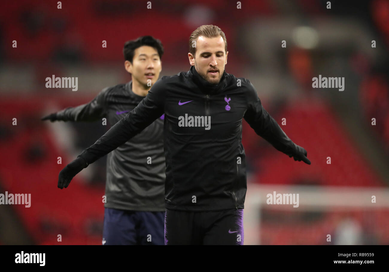 Tottenham Hotspur's Son Heung-min (left) and Harry Kane warm up prior ...