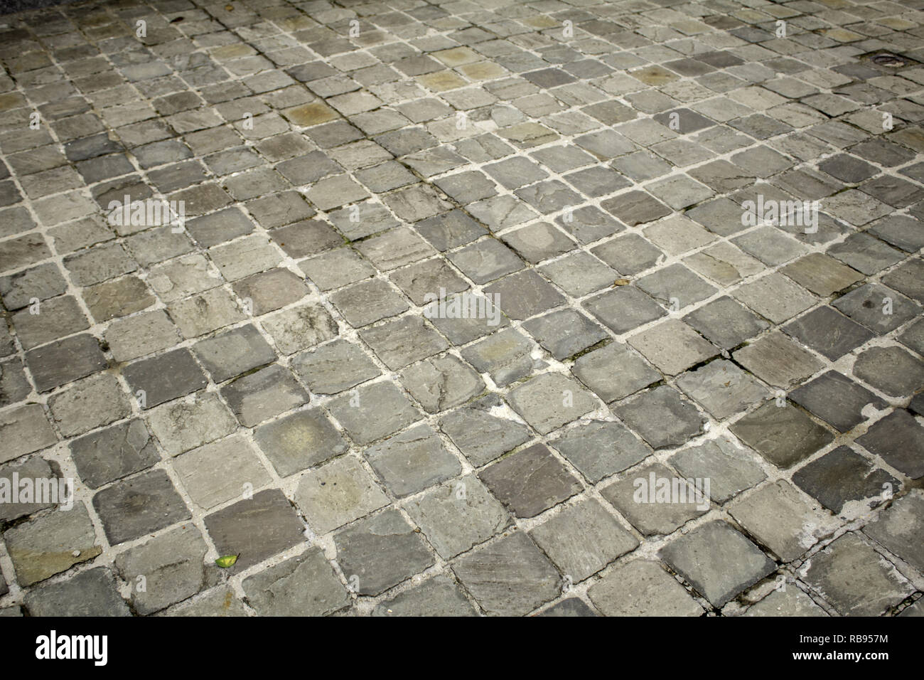 Flooring stone floor tiles in city street, construction Stock Photo - Alamy