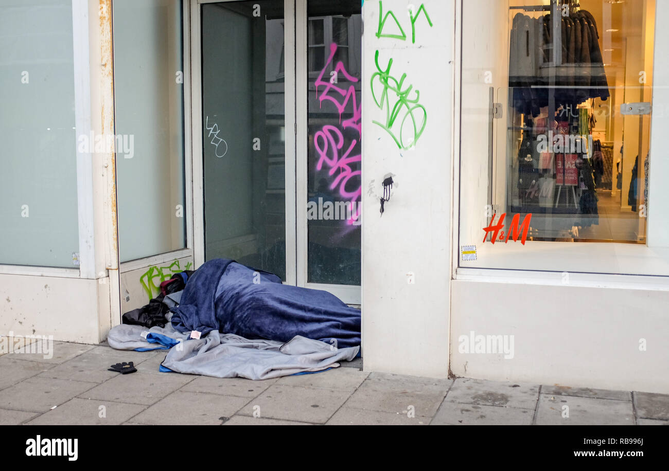 Brighton UK 8th January 2019 - Homeless sleeping rough in a shop ...
