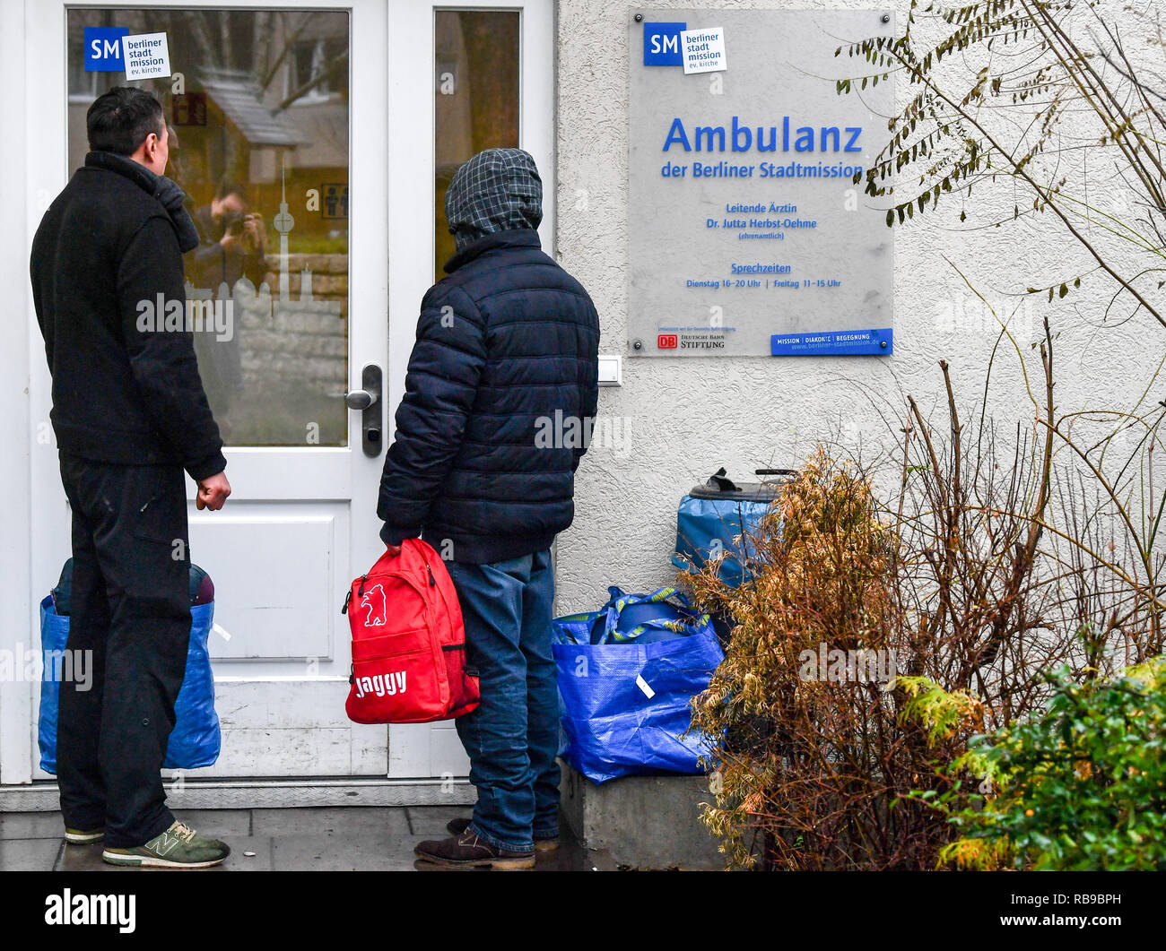 Berlin, Germany. 08th Jan, 2019. Two homeless people are waiting in ...
