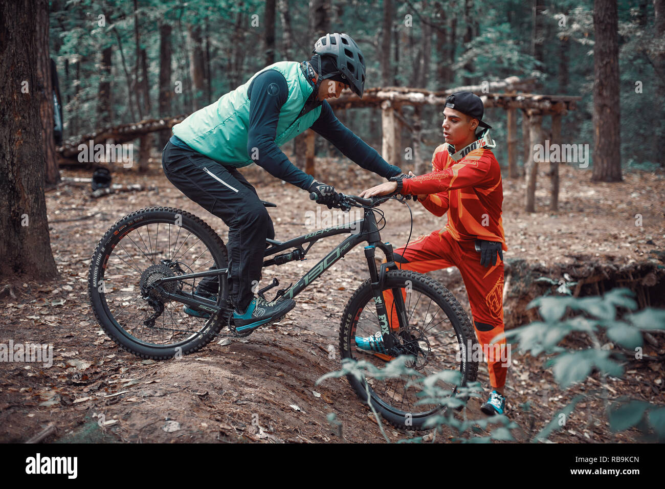 Moscow, Russia - Nov, 2018: MTB teacher helping rider learn to ride ...