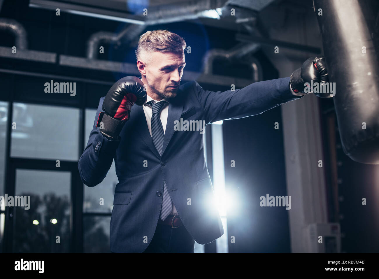 Punching bag man suit hi-res stock photography and images - Alamy