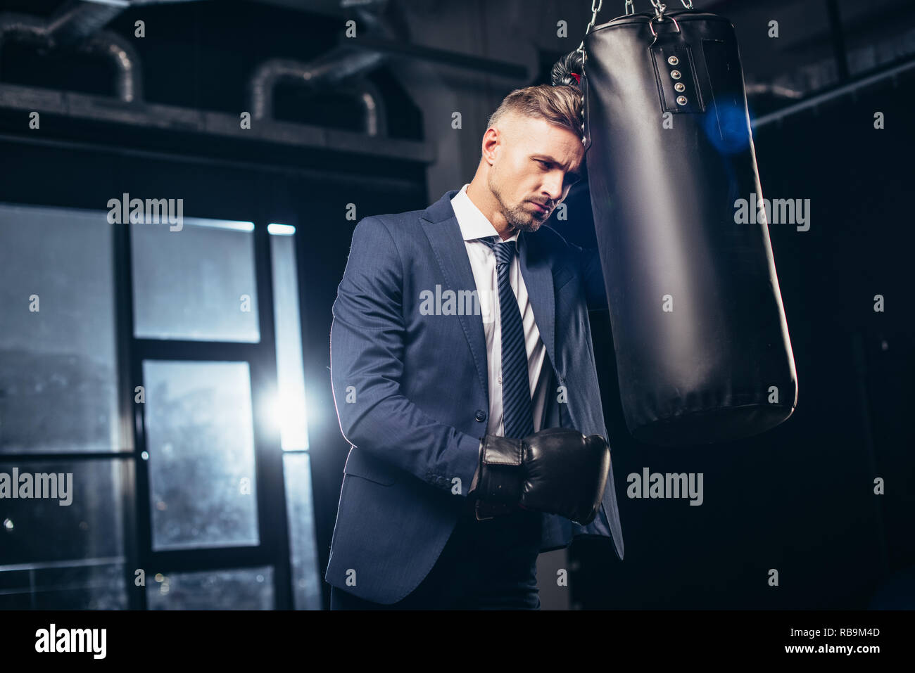 Punching bag man suit hi-res stock photography and images - Alamy