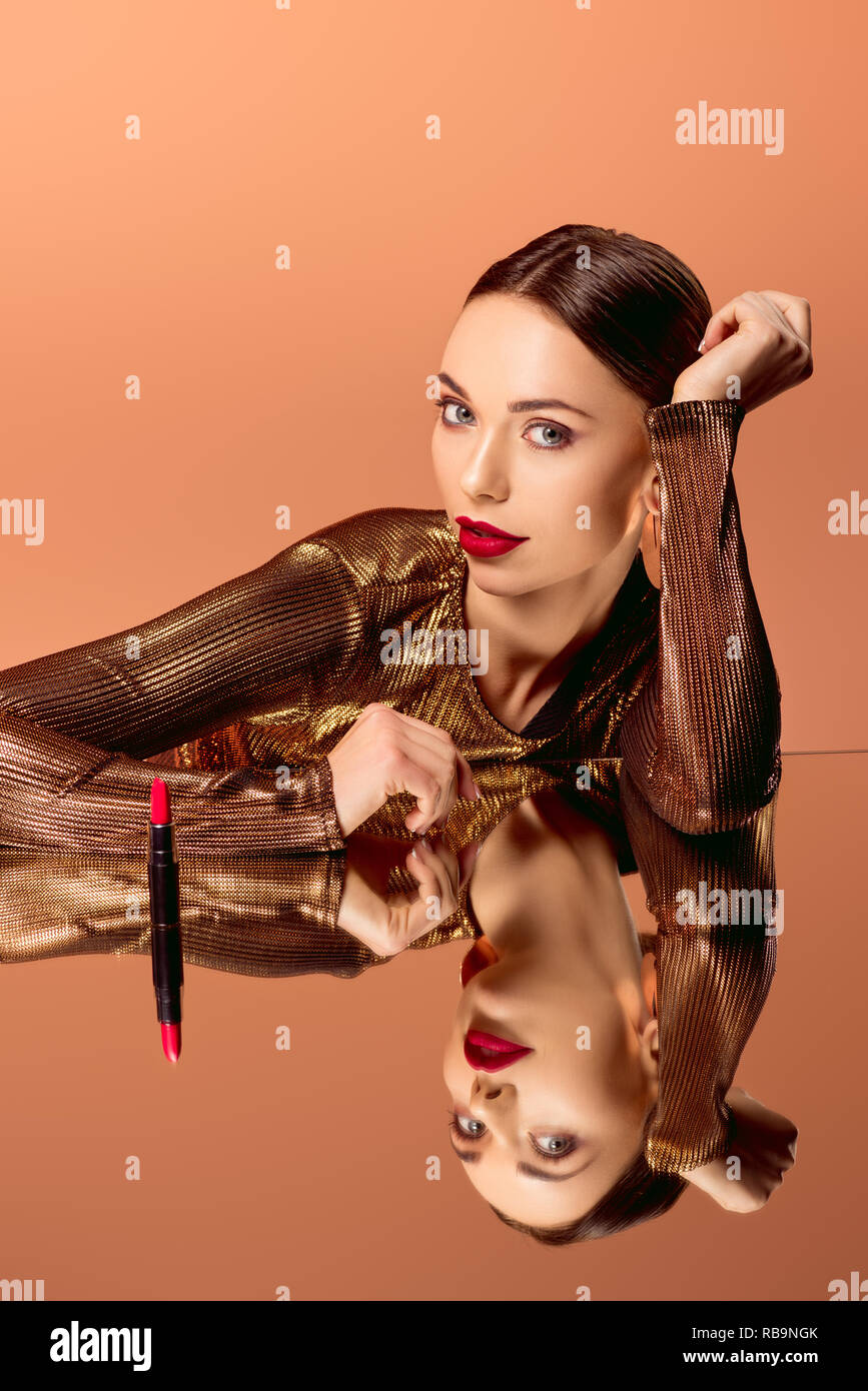 beautiful woman with glamorous makeup, mirror reflection and red ...