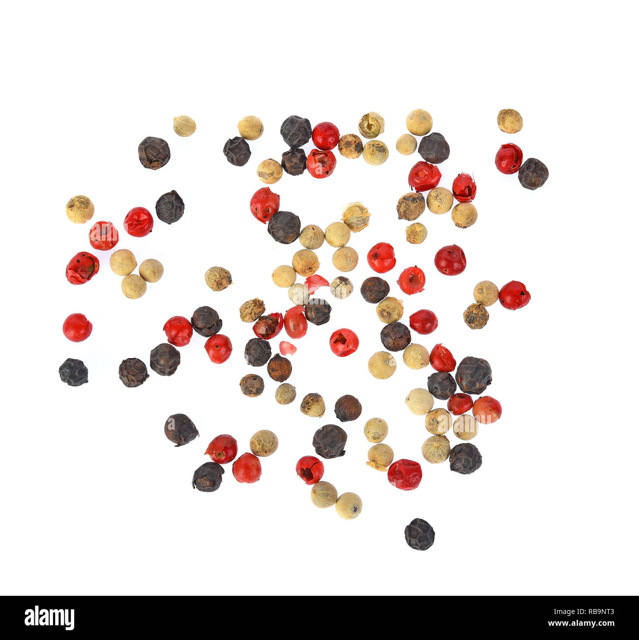 pepper corns on white background. Top view Stock Photo - Alamy