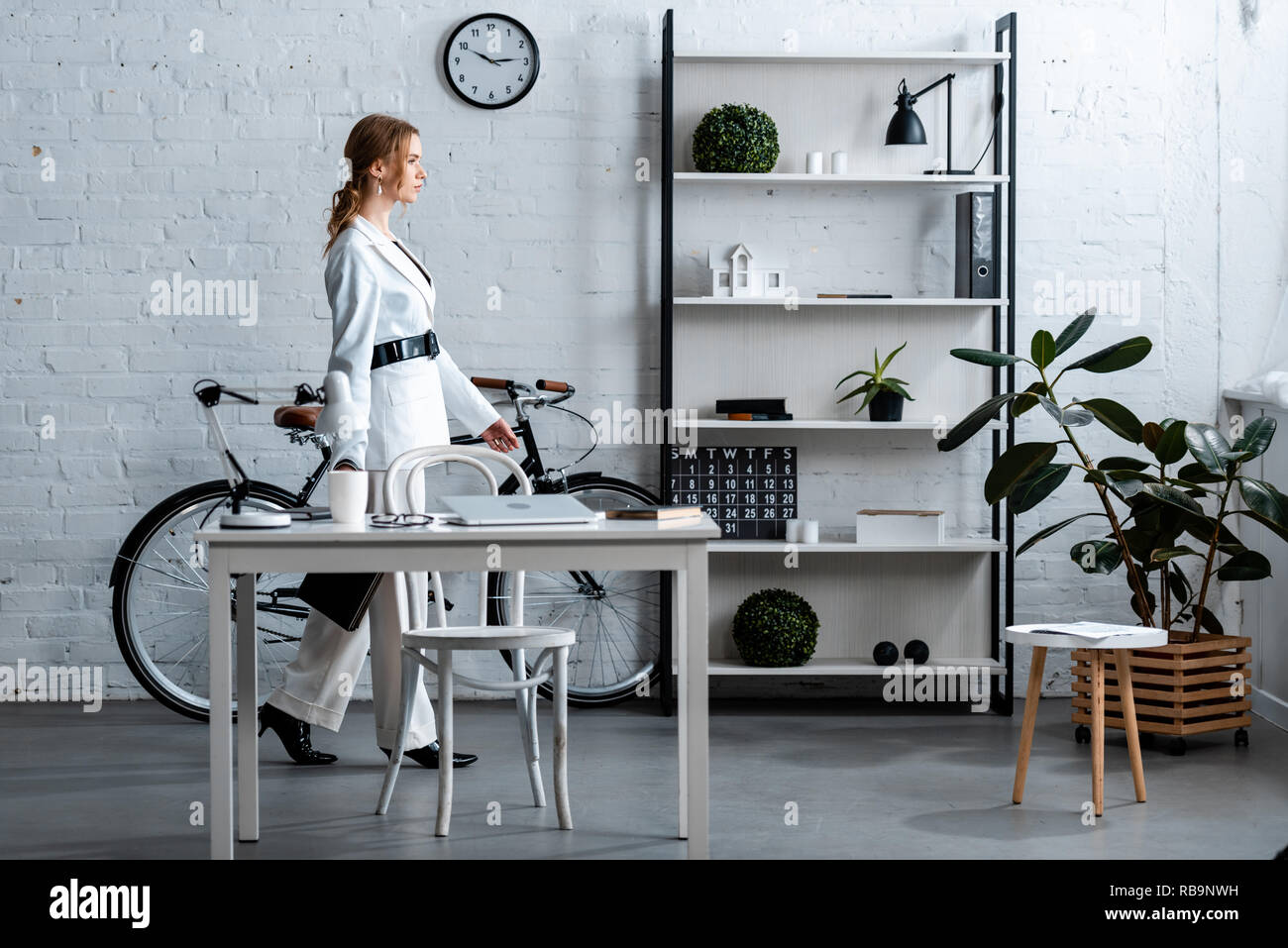 businesswoman in formal wear in modern office interior Stock Photo - Alamy