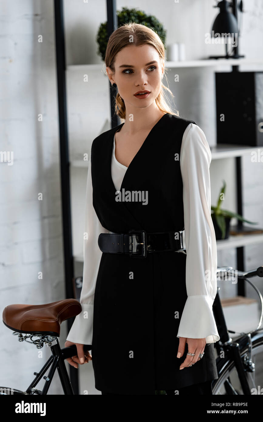 beautiful stylish woman in black formal wear looking away Stock Photo ...
