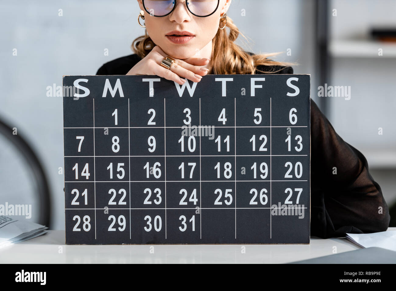 Holding calendar hi-res stock photography and images - Alamy