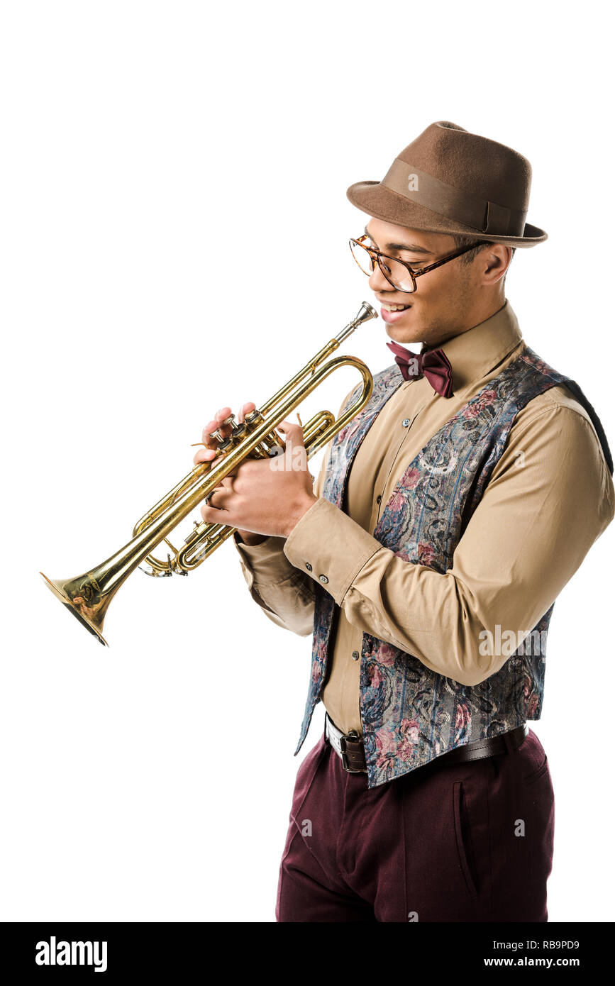happy young mixed race male jazzman posing with trumpet isolated on ...