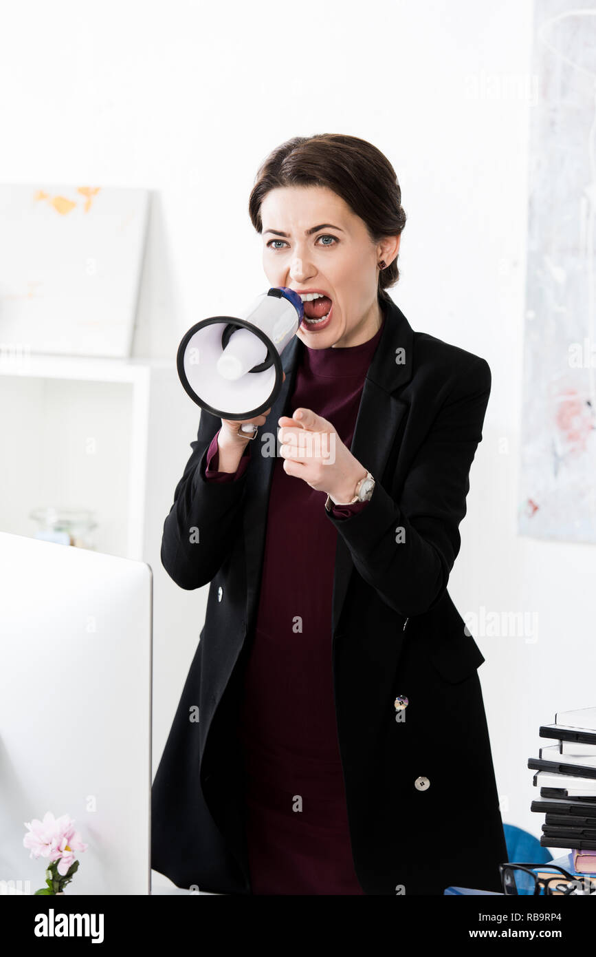 Woman megaphone office hi-res stock photography and images - Alamy