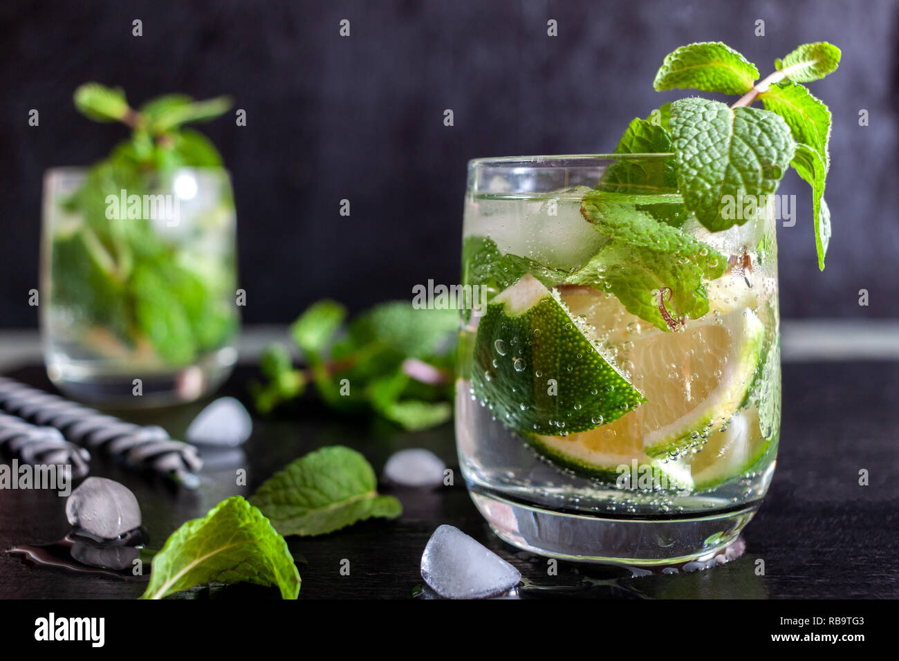 Mojito Cubano or caipirinha cocktail, iced drink with lime and mint ...