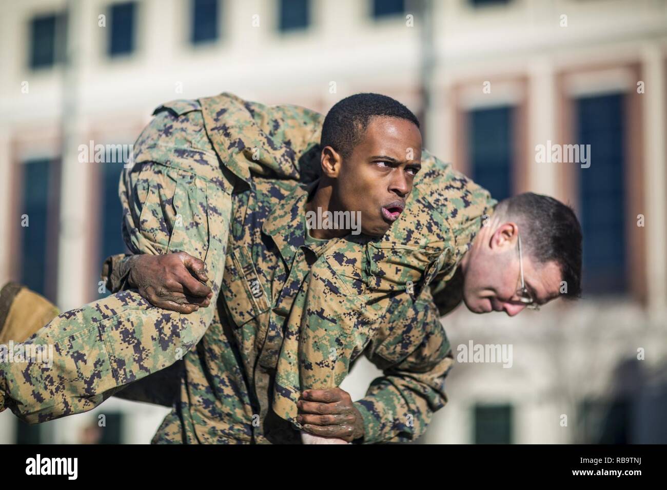 A Marine with Marine Forces Reserve conducts a fireman carry during the ...