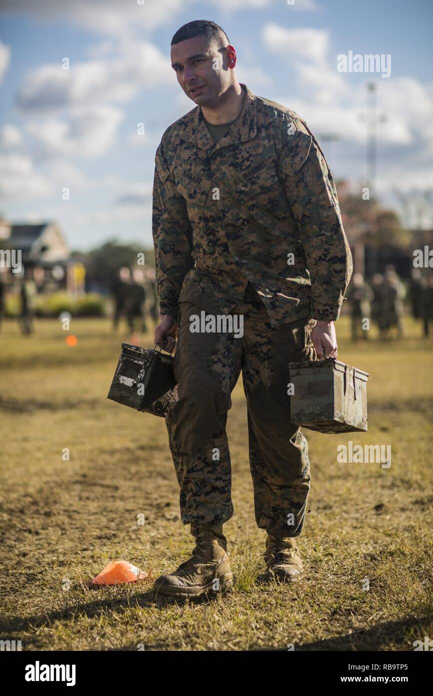 A Marine with Marine Forces Reserve sprints with two ammo cans during ...