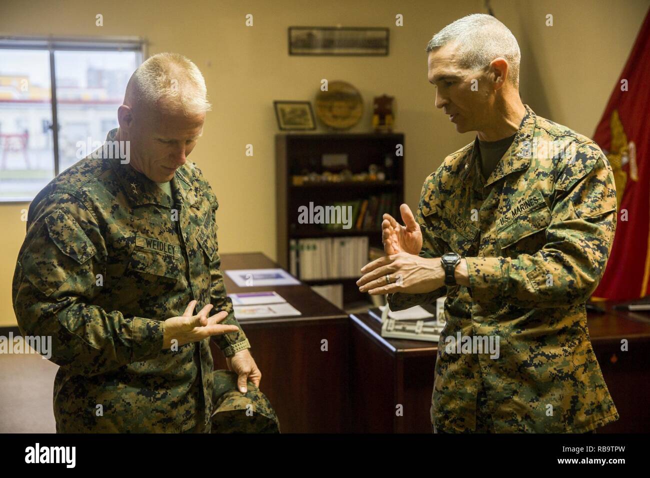 Maj. Gen. Thomas D. Weidley receives a coin from Lt. Col. Prescott ...