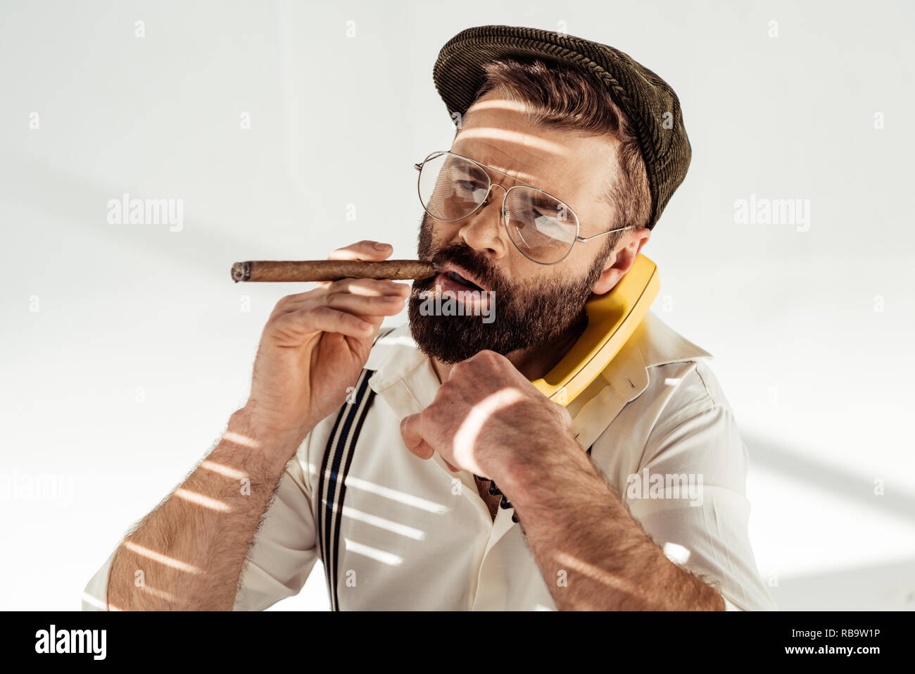 Man smoking in shadows hi-res stock photography and images - Alamy